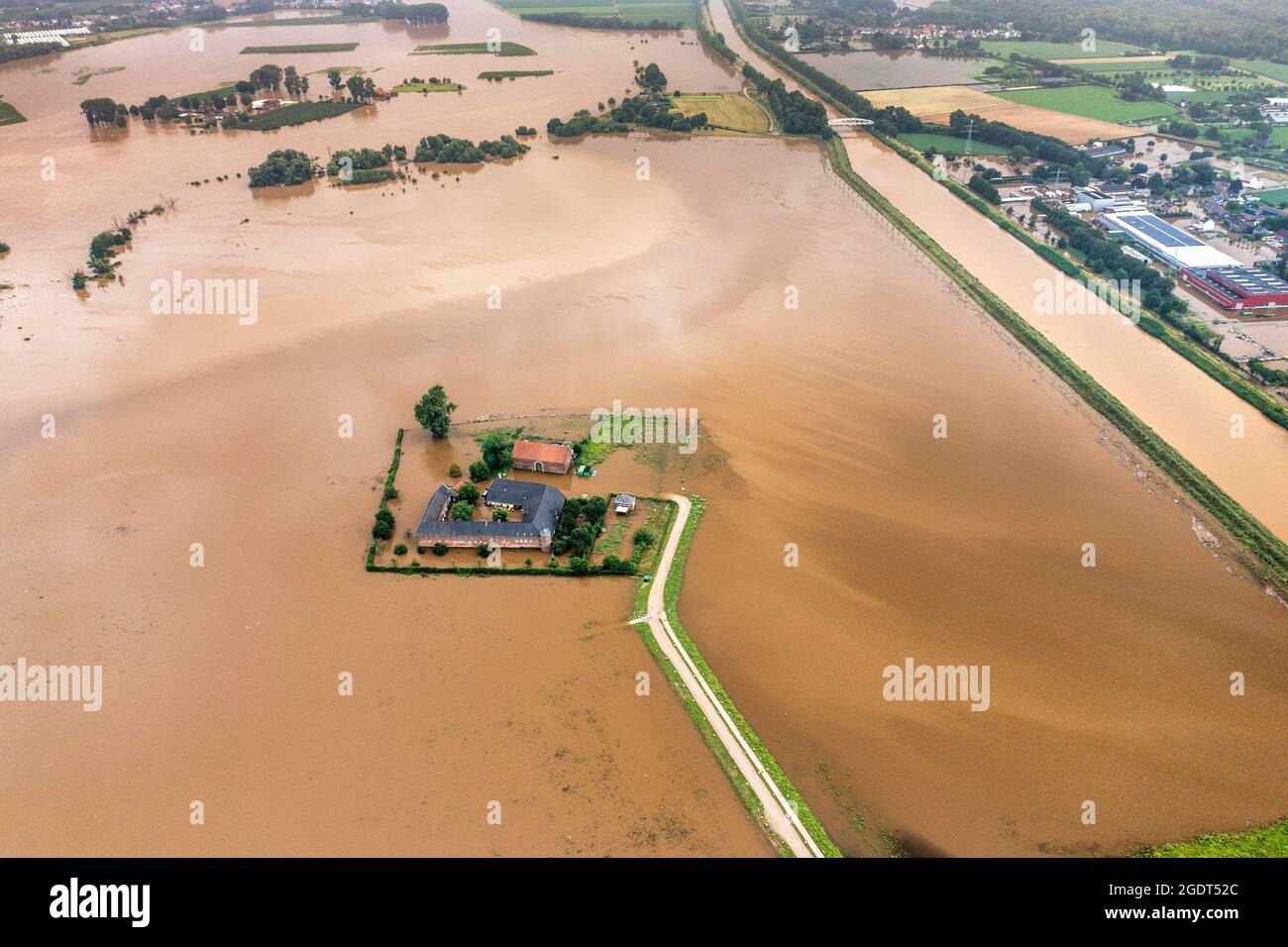 The Netherlands, Itteren. Flooded farm and farmland due to flooding of ...