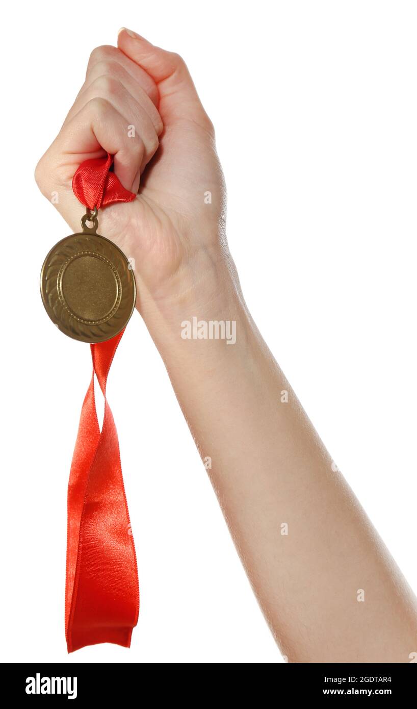 Golden medal in hand isolated on white Stock Photo - Alamy