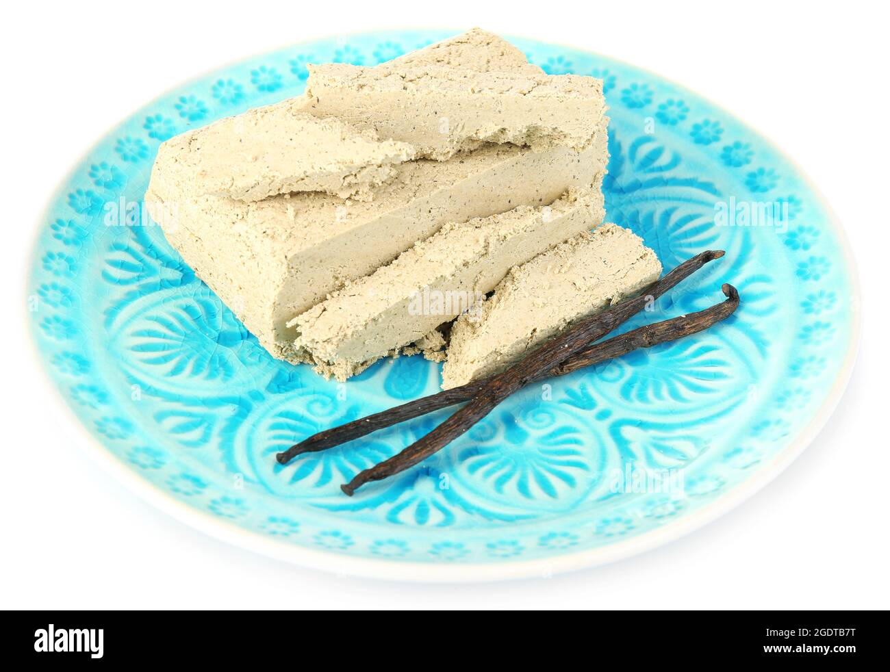 Sunflower halva on plate isolated on white background Stock Photo - Alamy