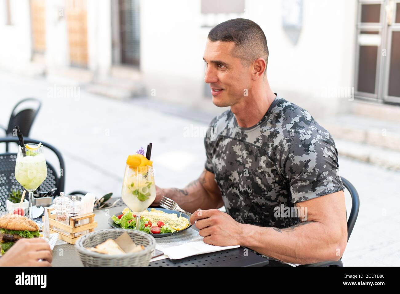 Portrait of Adult Man Eating Omelet or Scrambled Eggs Outdoors at ...