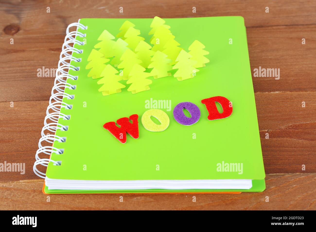 Concept of conservation forests cut paper on notebook Stock Photo - Alamy