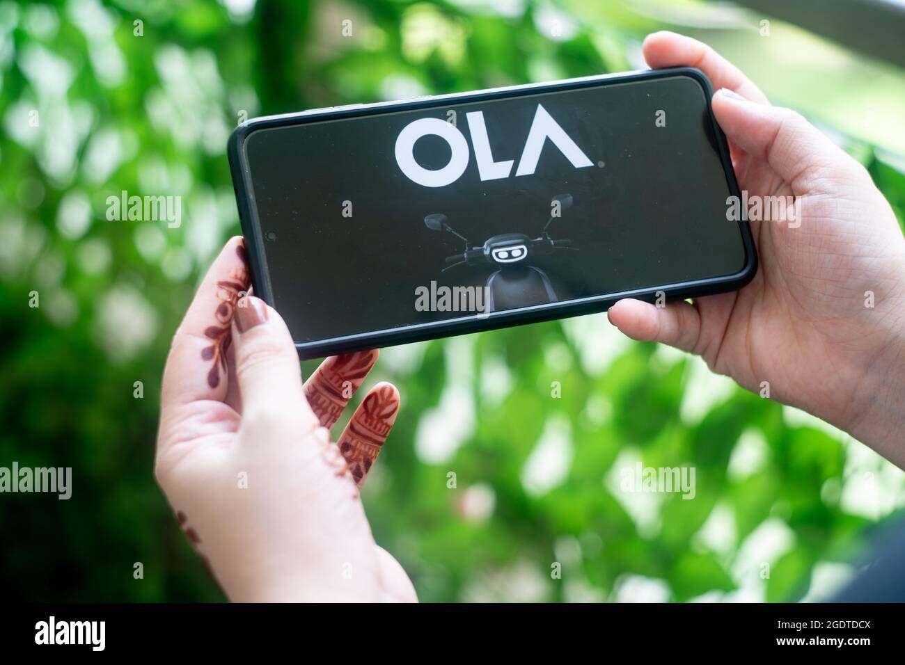 Mobile phone smartphone showing website app bor booking Ola Electric ...