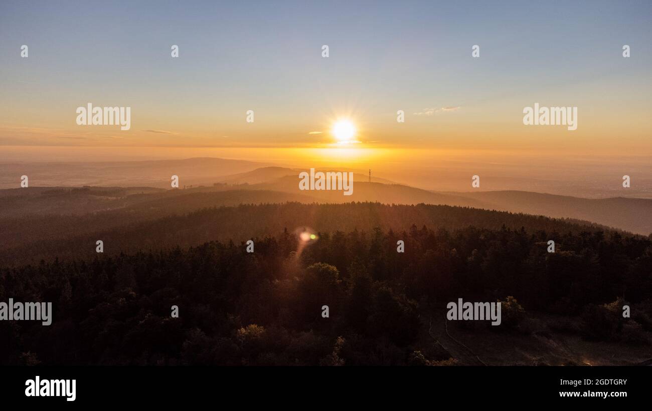 Schmitten, Germany. 15th Aug, 2021. The sun rises over the Feldberg ...