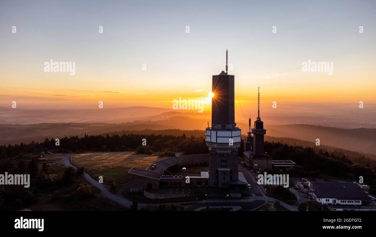 Schmitten, Germany. 15th Aug, 2021. The sun rises over the Feldberg ...