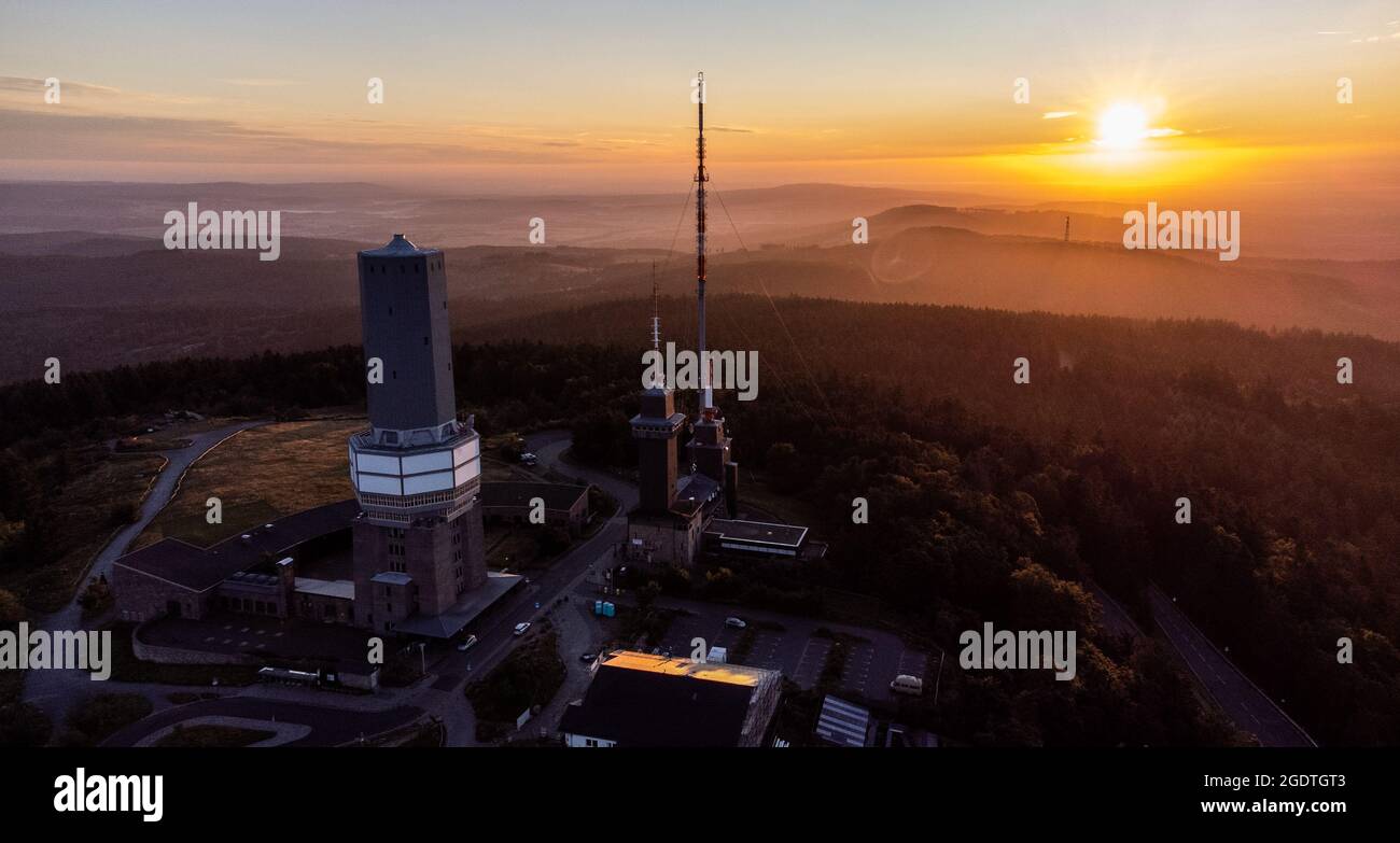 Schmitten, Germany. 15th Aug, 2021. The sun rises over the Feldberg ...
