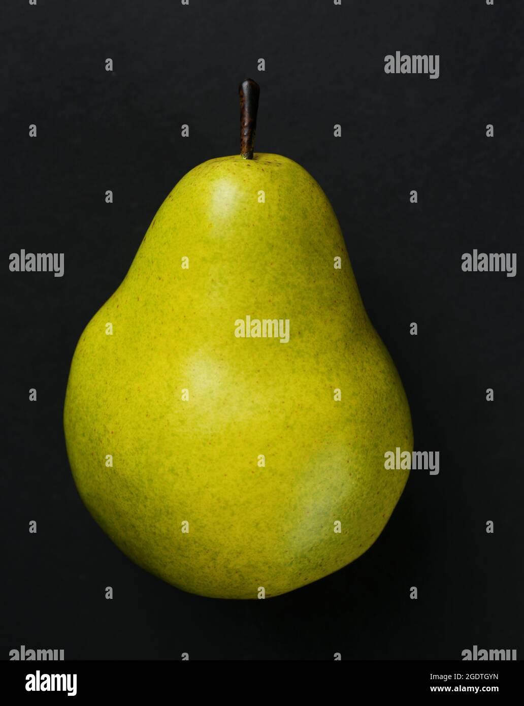 Pear on black background Stock Photo - Alamy