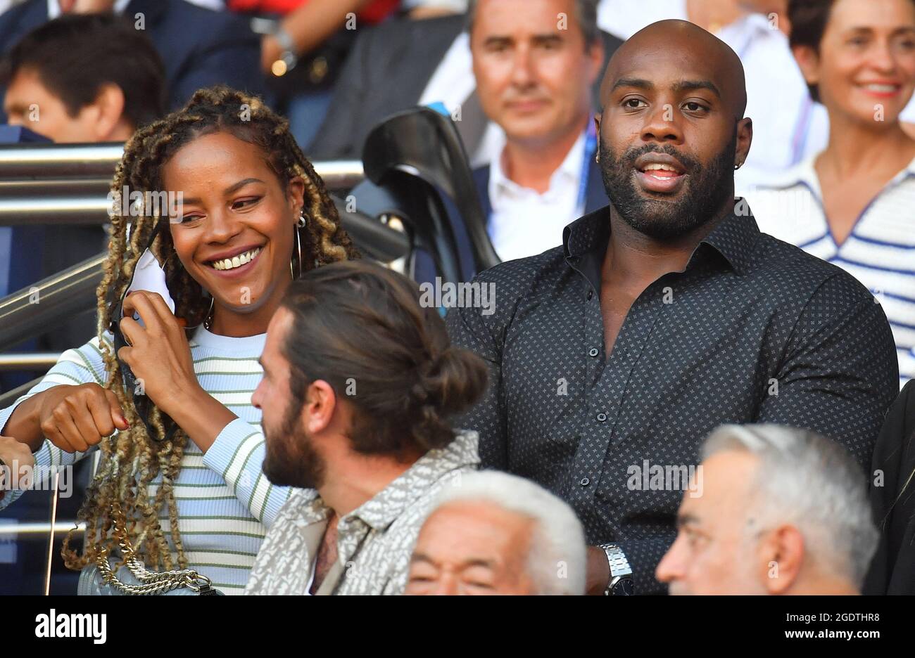 Teddy Riner and his wife Luthna Plocus attend he French L1 football ...