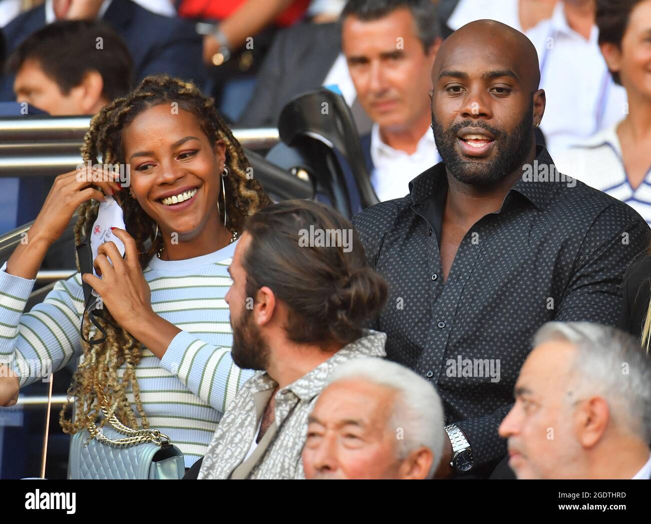 Teddy Riner and his wife Luthna Plocus attend he French L1 football ...