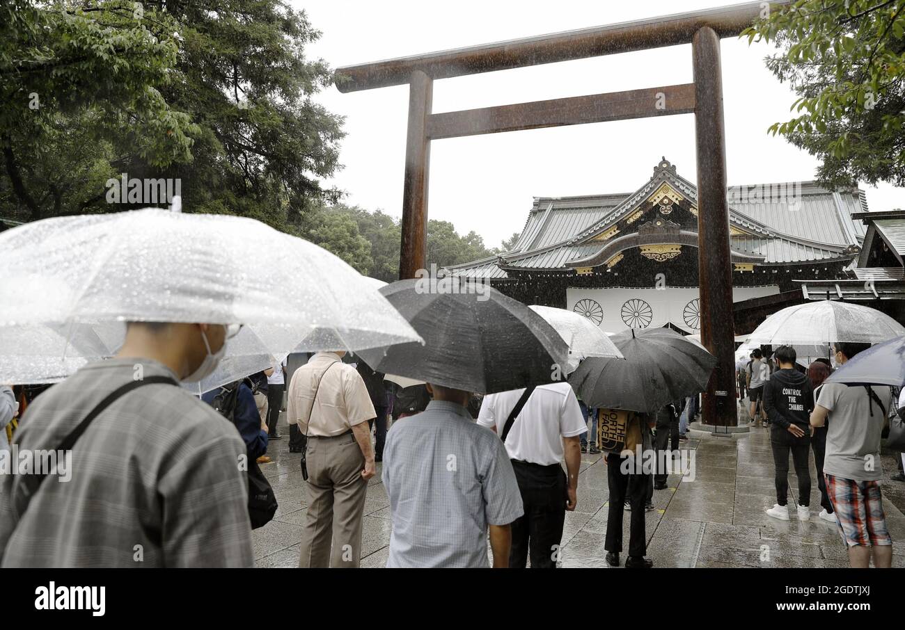 People pray at Tokyo's Yasukuni shrine on Aug. 15, 2021, the 76th ...