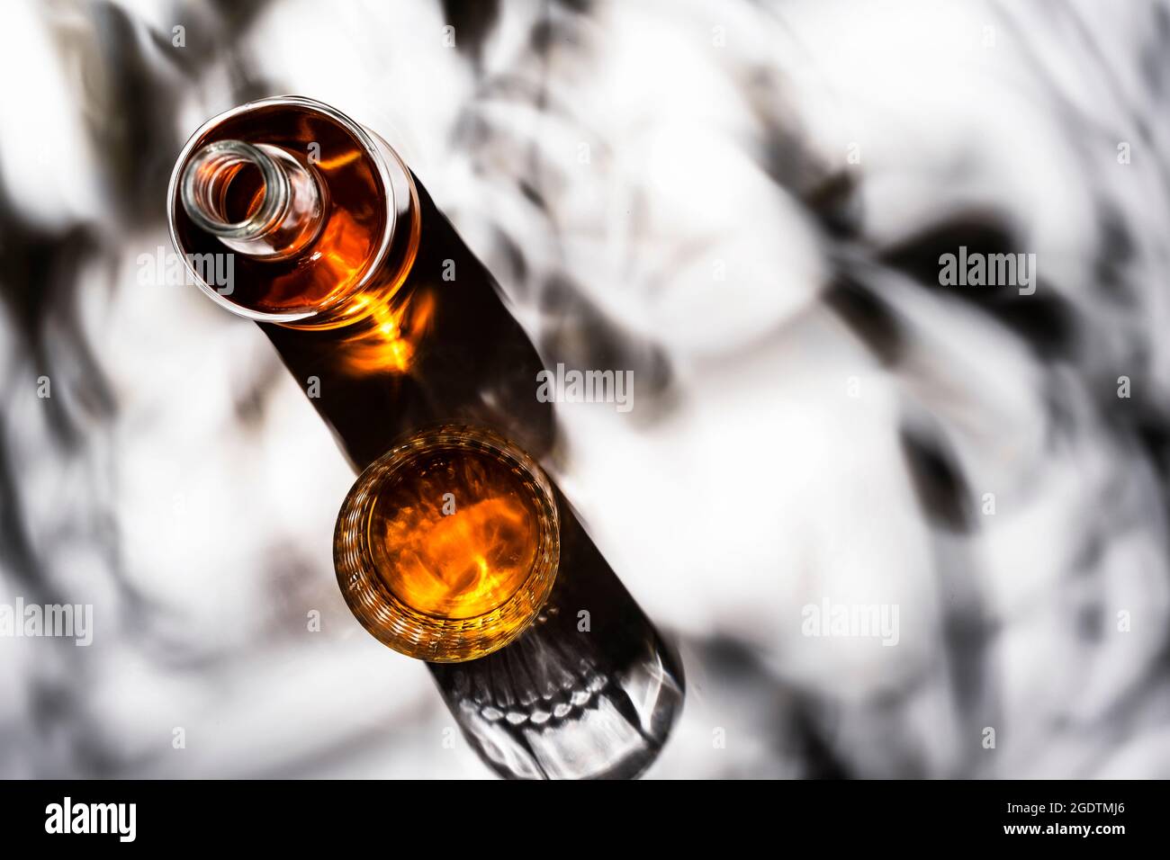 American bourbon whiskey in glasses and bottle, white background with ...