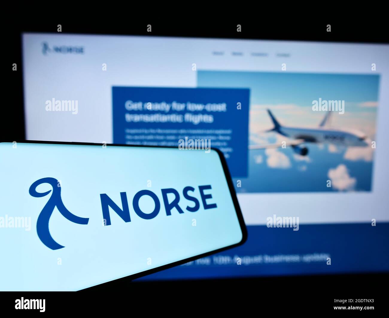 Mobile phone with logo of Norwegian airline Norse Atlantic Airways on ...