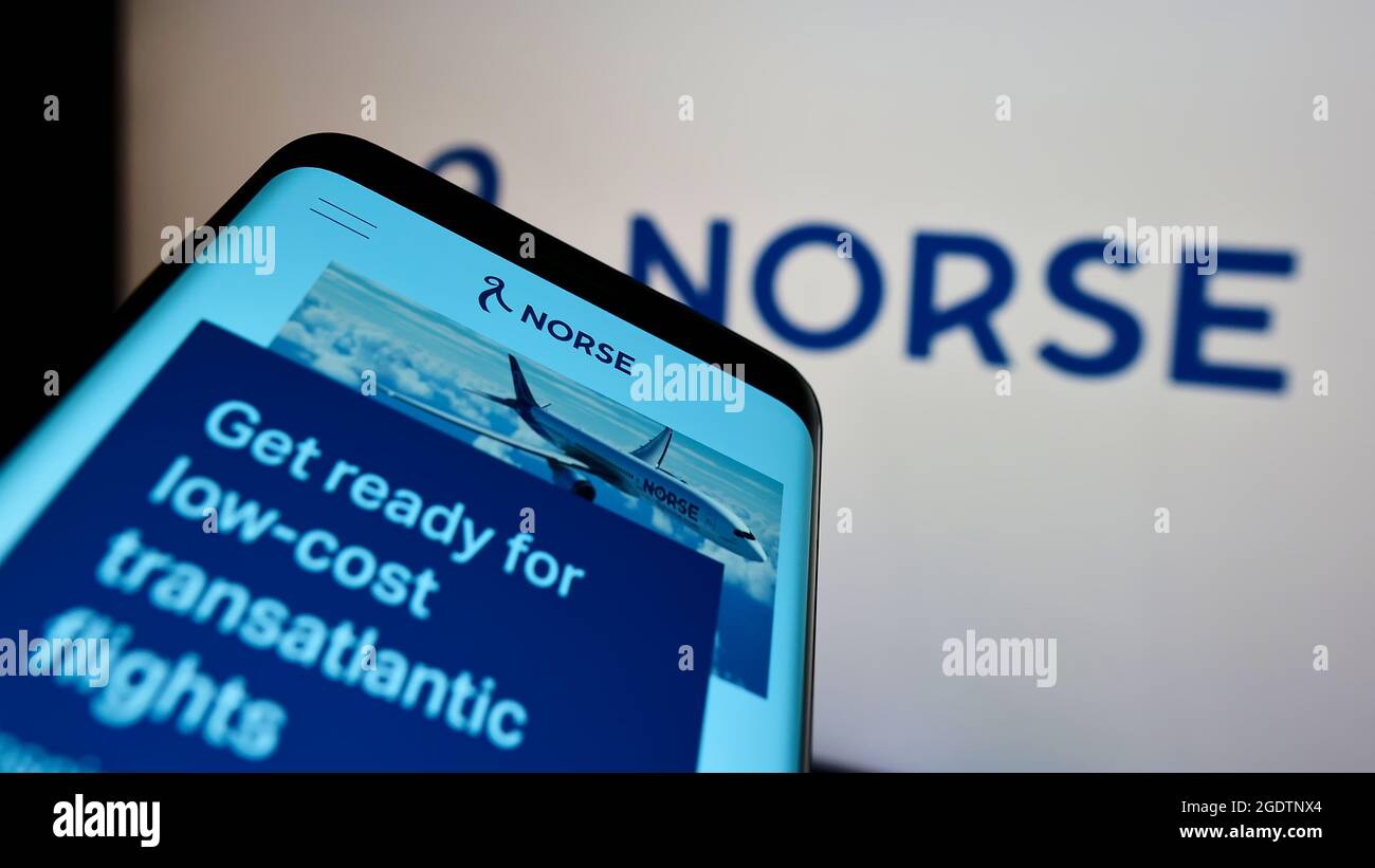 Smartphone with website of Norwegian airline Norse Atlantic Airways on ...
