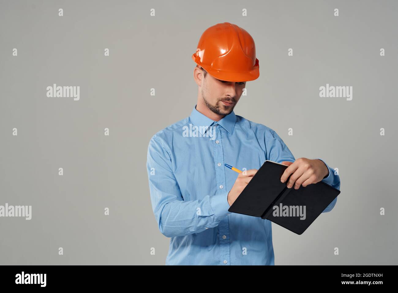 male builders blueprints builder light background Stock Photo - Alamy