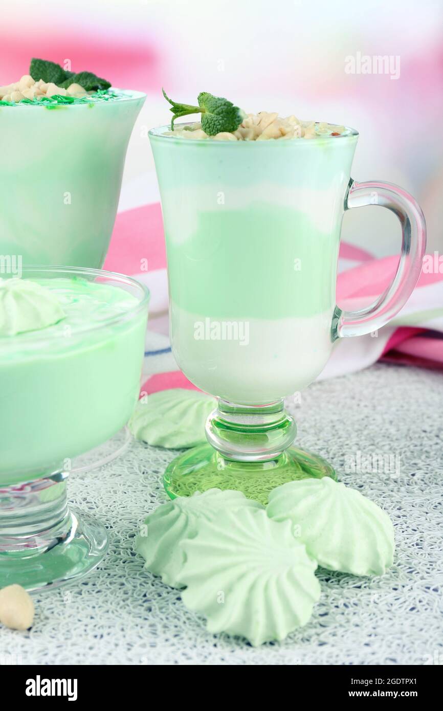 Mint milk dessert in glass bowls on color wooden background Stock Photo ...