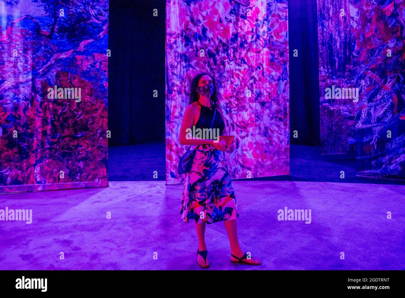 Toronto, Canada. 11th Aug, 2021. A woman attends the Beyond Monet ...