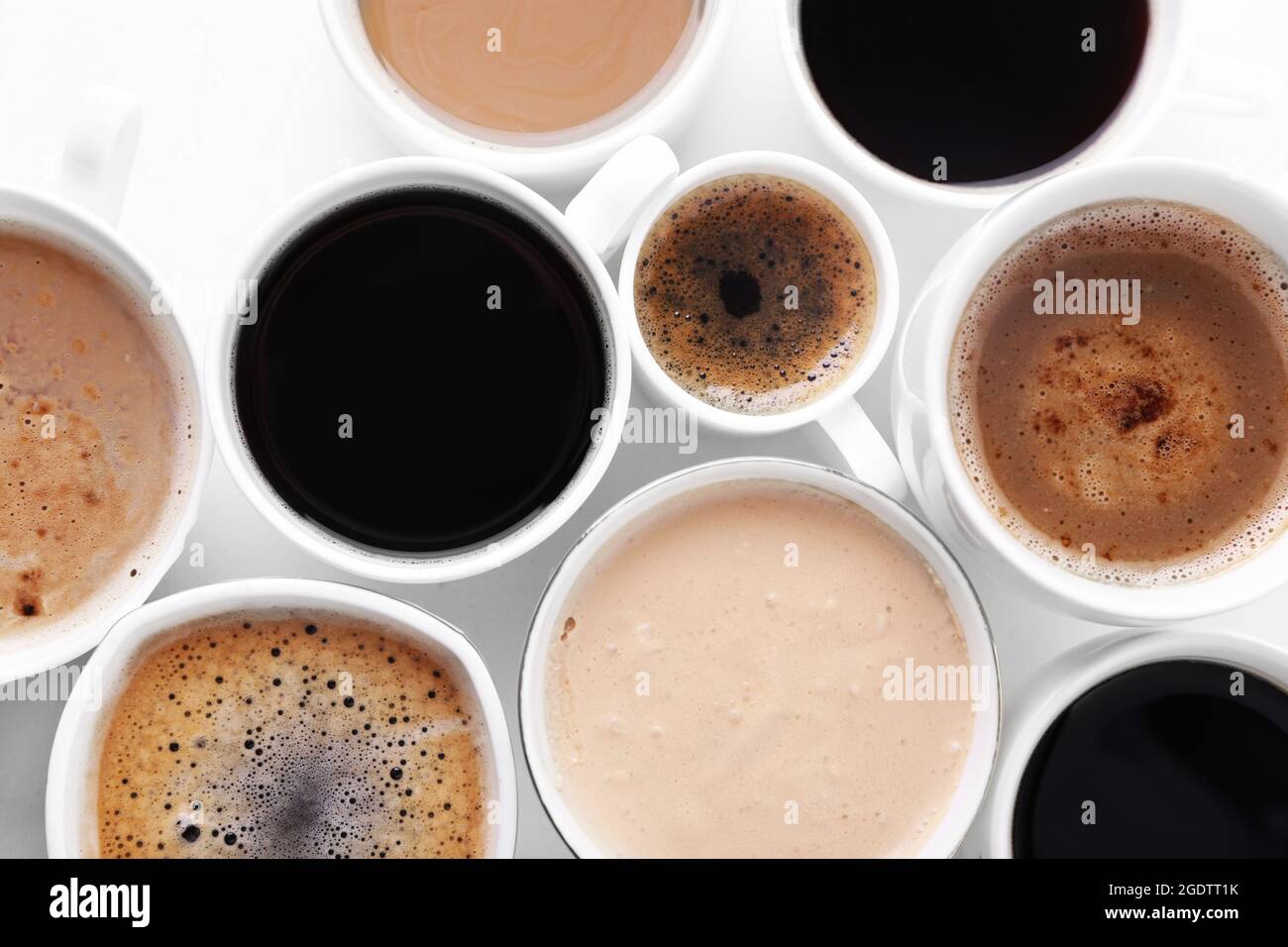 Lots of coffee cups on white background Stock Photo - Alamy