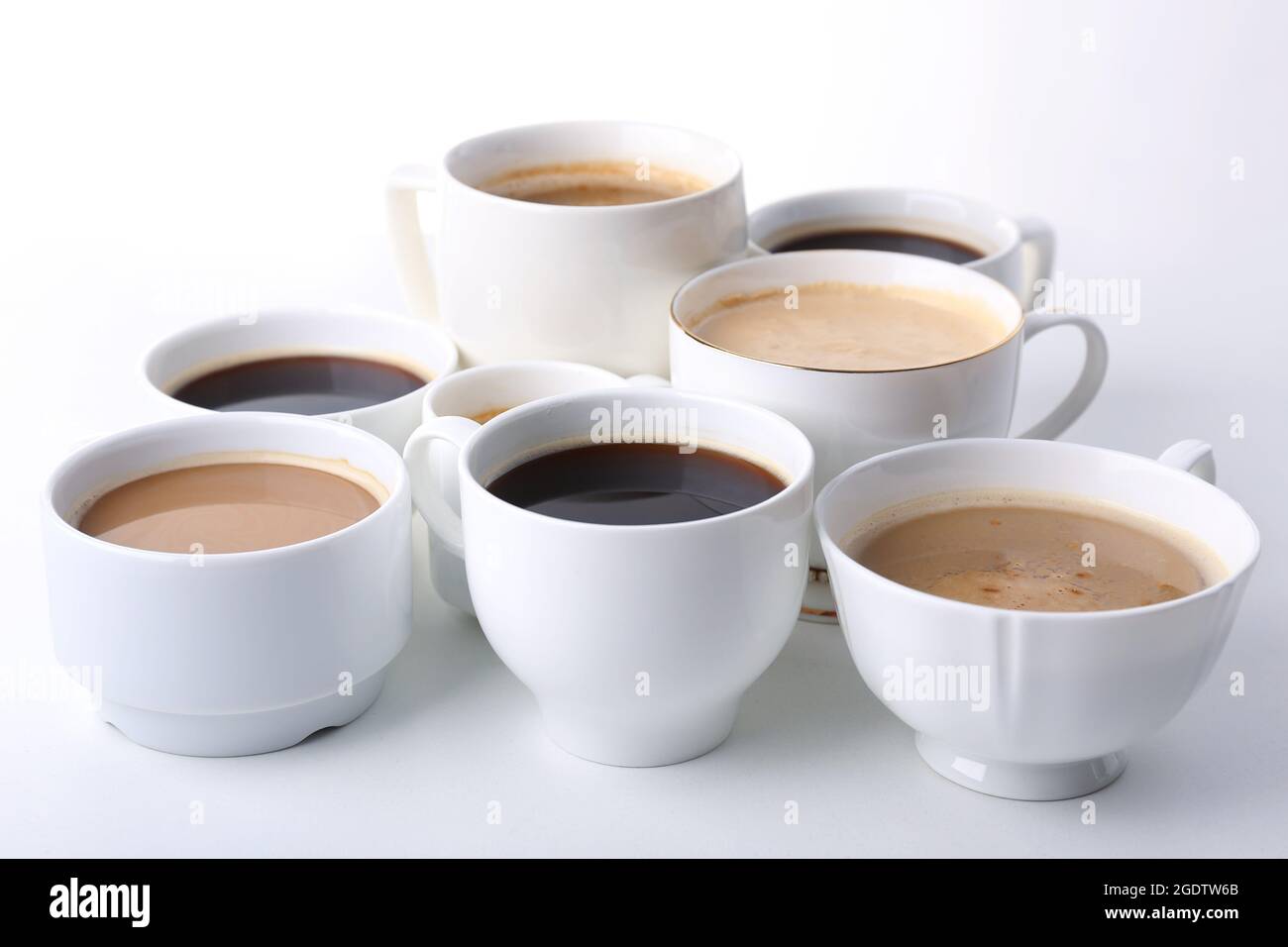 Lots of coffee cups on white background Stock Photo - Alamy