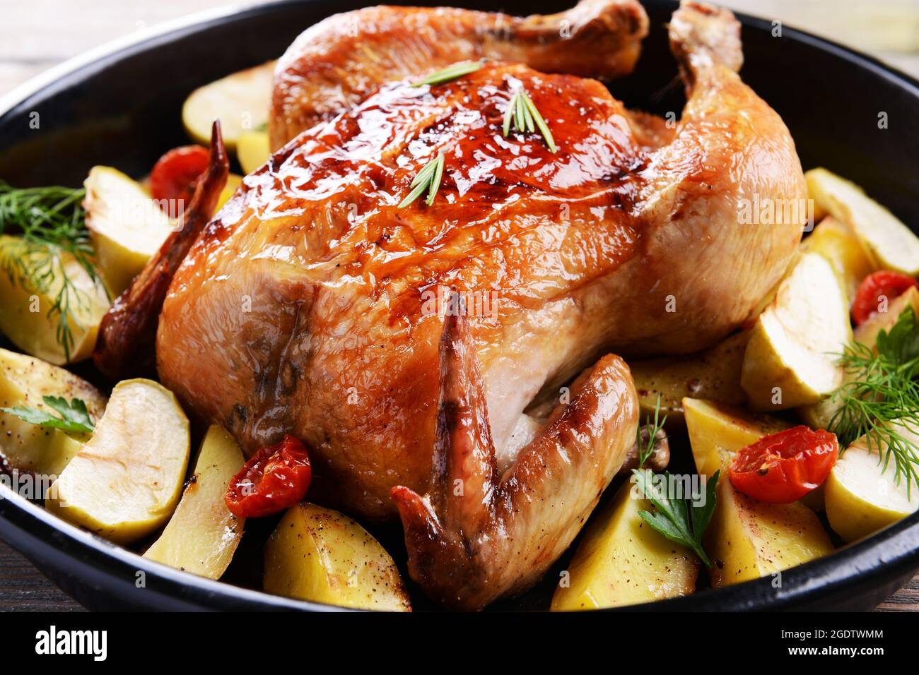 Delicious baked chicken on table close-up Stock Photo - Alamy