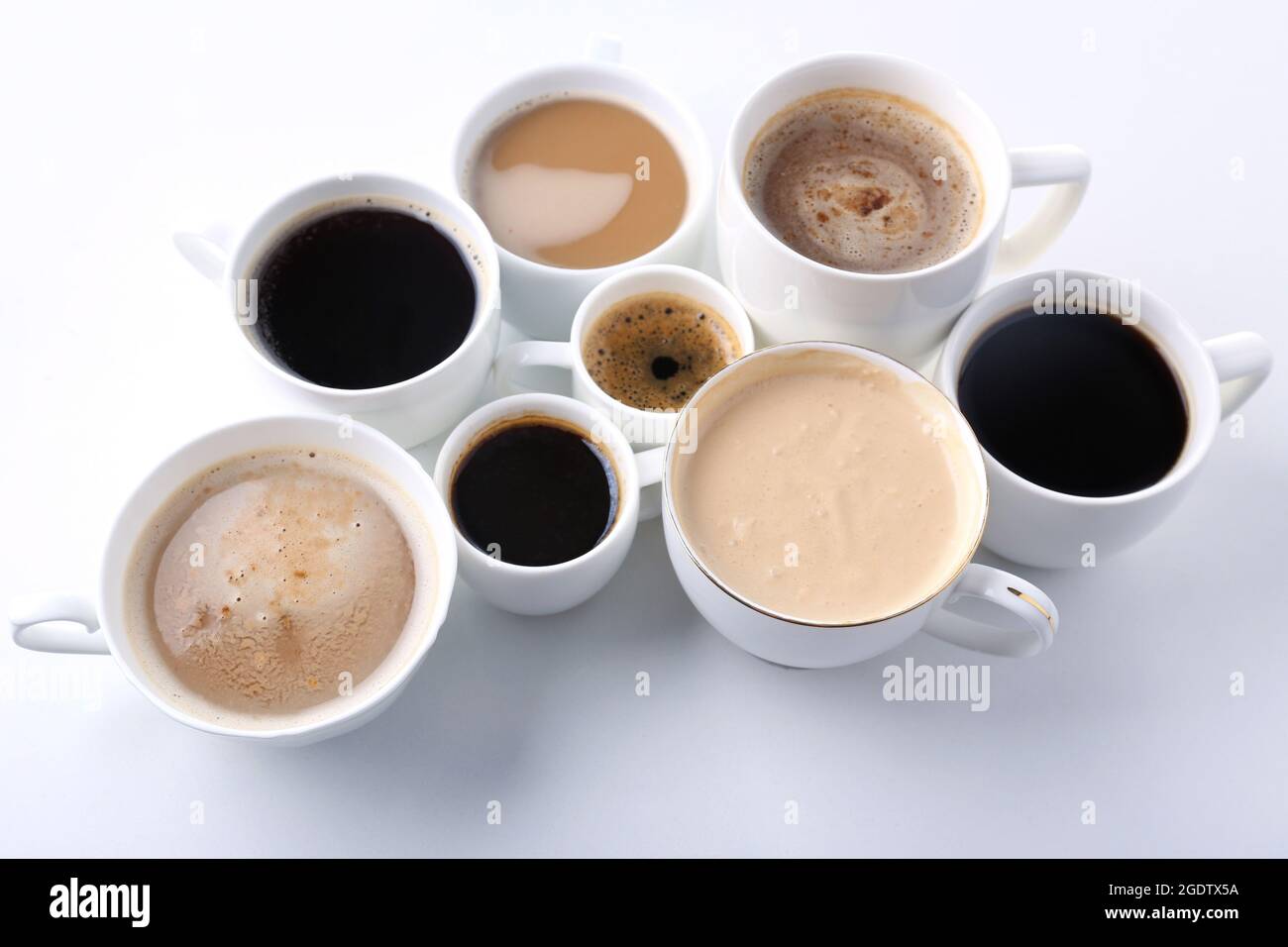 Lots of coffee cups on white background Stock Photo - Alamy
