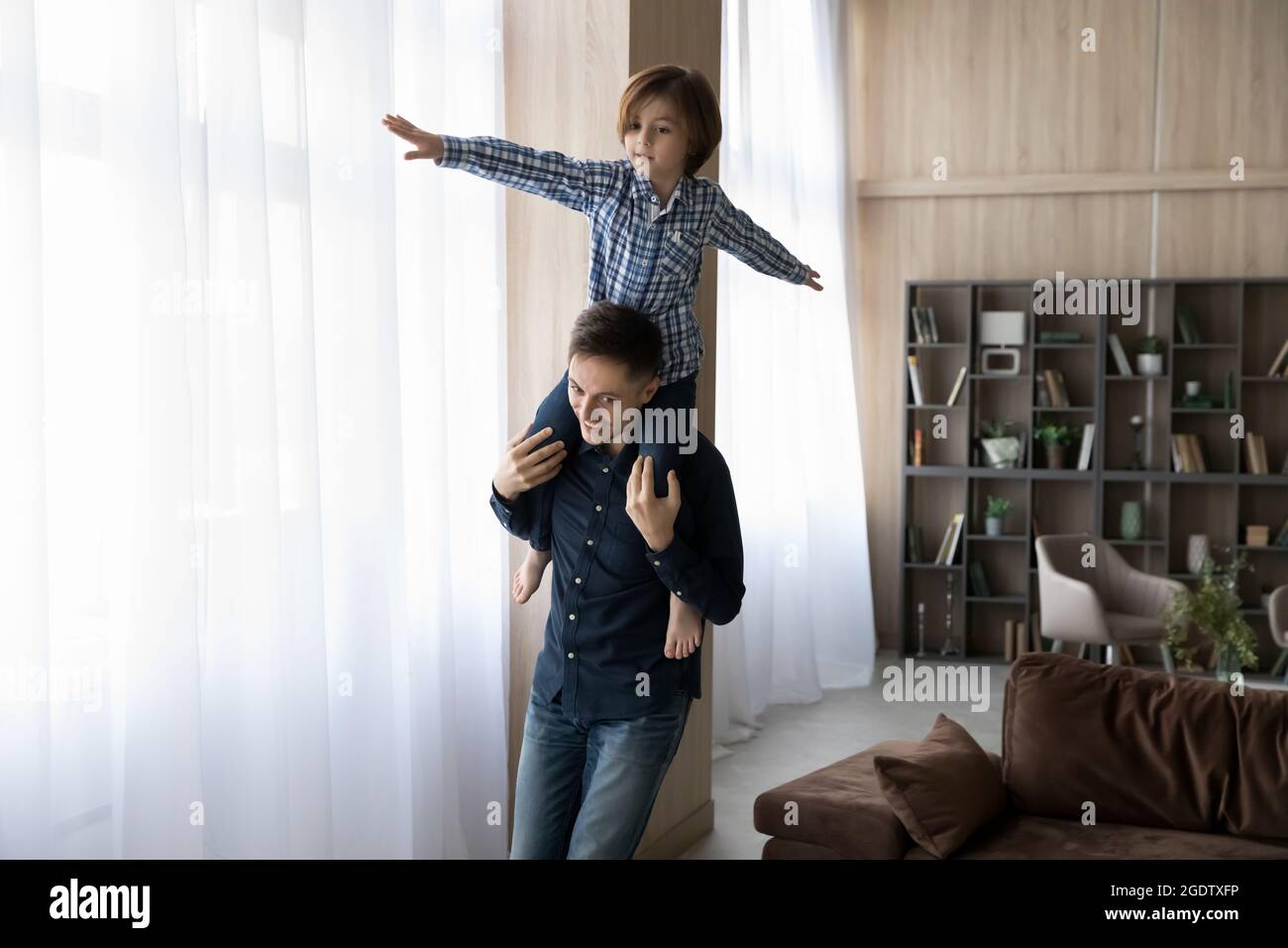 Child sits on shoulders hi-res stock photography and images - Alamy