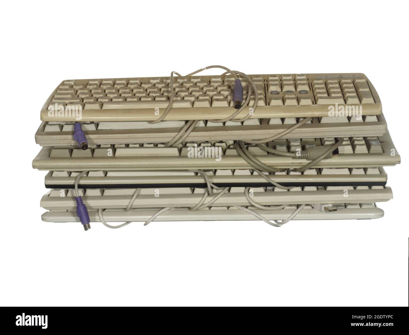 Stack of old worn keyboards isolated on white background Stock Photo ...
