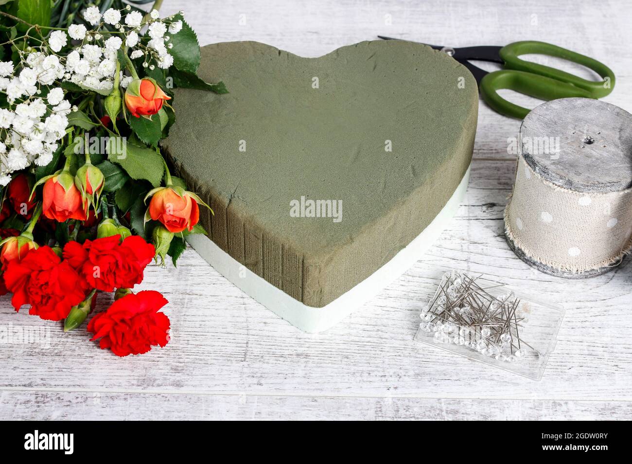 Florist at work: How to make floral arrangement in heart shape with carnations, chrysanthemums ...