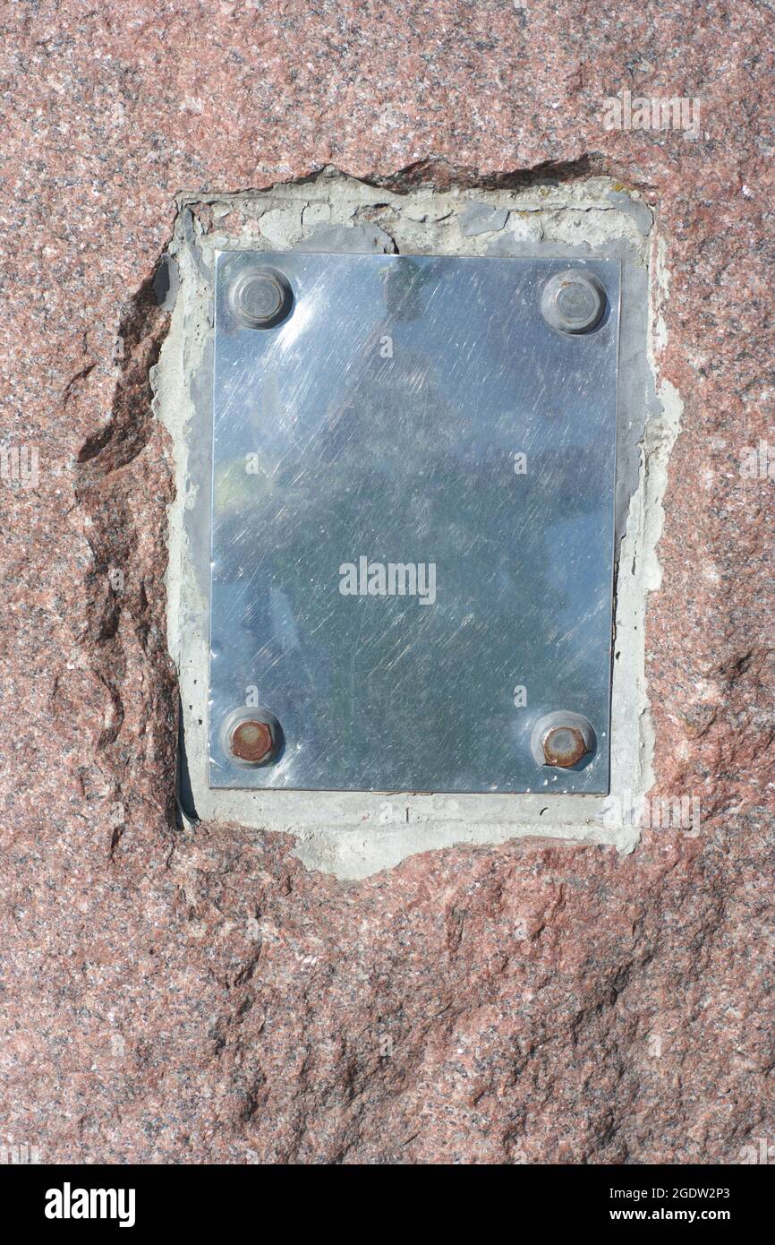 metal plate on granite stone in park at dry sunny summer day Stock ...