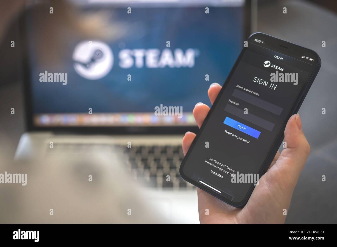 Kharkov, Ukraine - August 12, 2021: Steam app. Woman using smartphone ...