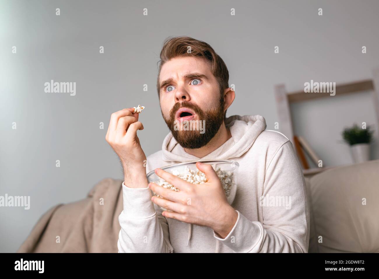 Portrait of guy watching TV series online. Online cinema and video ...