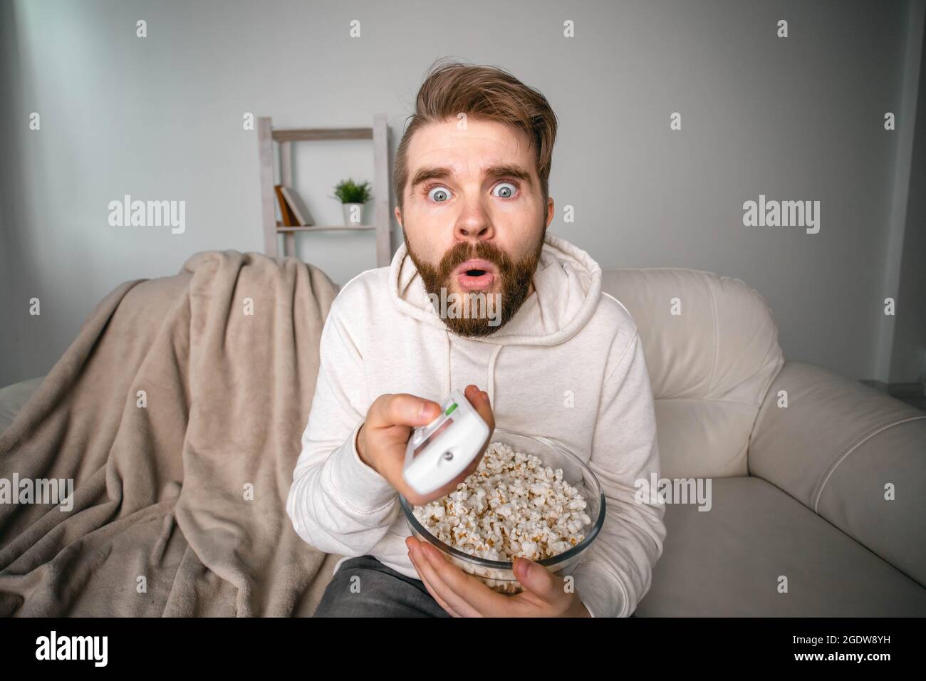 Portrait of guy watching TV series online. Online cinema and video ...