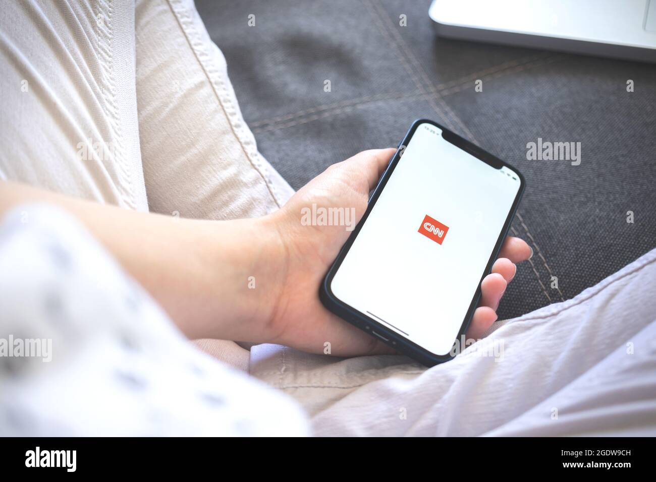 Kharkov, Ukraine - August 12, 2021: Cnn app. Woman using smartphone ...