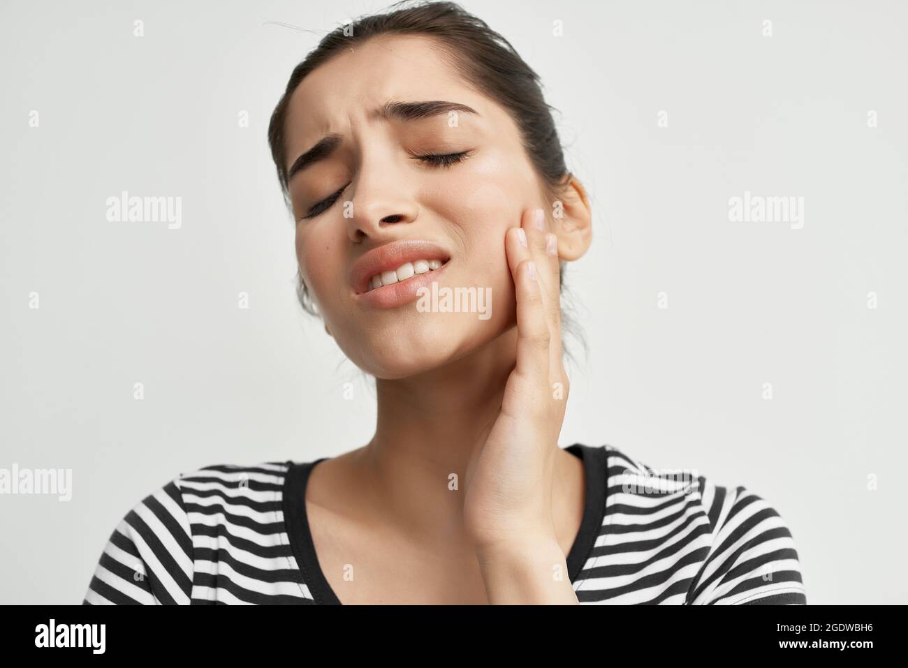 woman with toothache holding face health problems dentistry ...