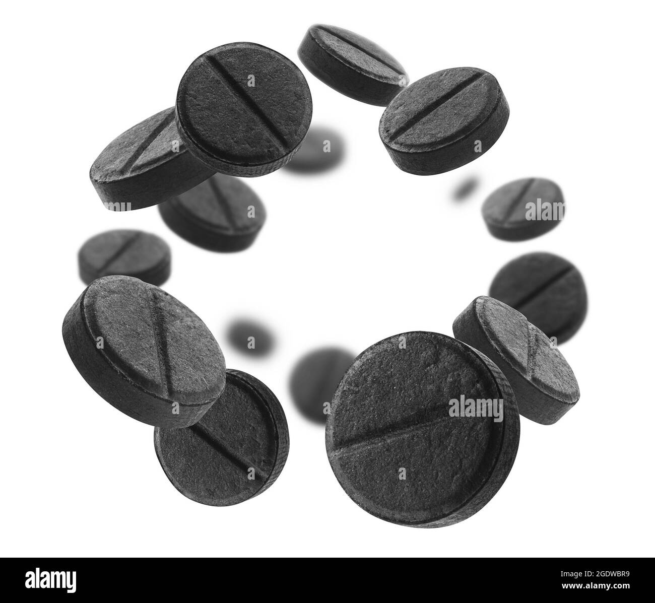 Black activated carbon tablets levitate on a white background Stock ...