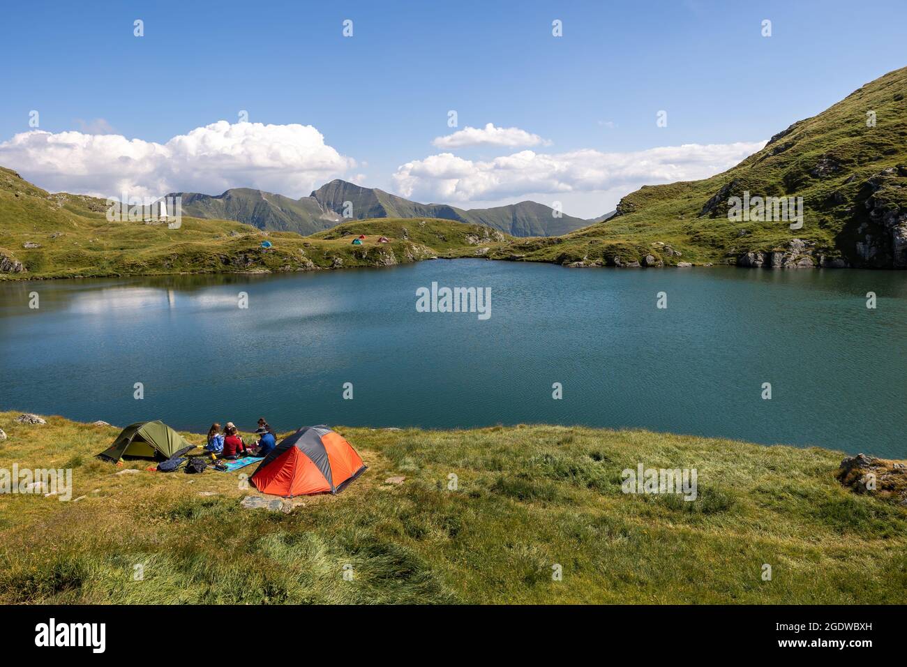 Camping tents on capra mountain lake in fagaras mountains romania Stock ...