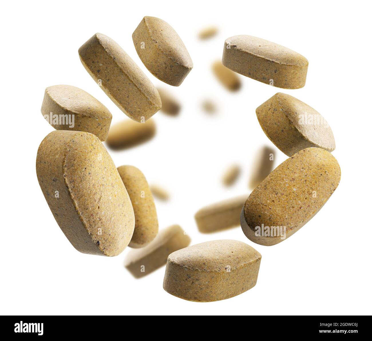 Yellow tablets levitate on a white background Stock Photo - Alamy