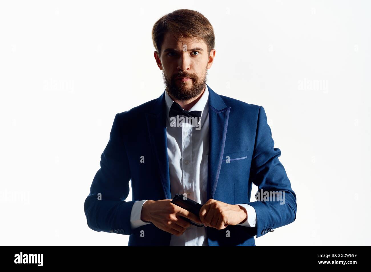 male Agent with a gun in hand isolated background Stock Photo - Alamy