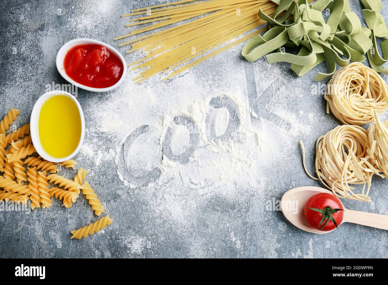 Handwritten word cook on grey stone background. Kitchen ideas Stock ...