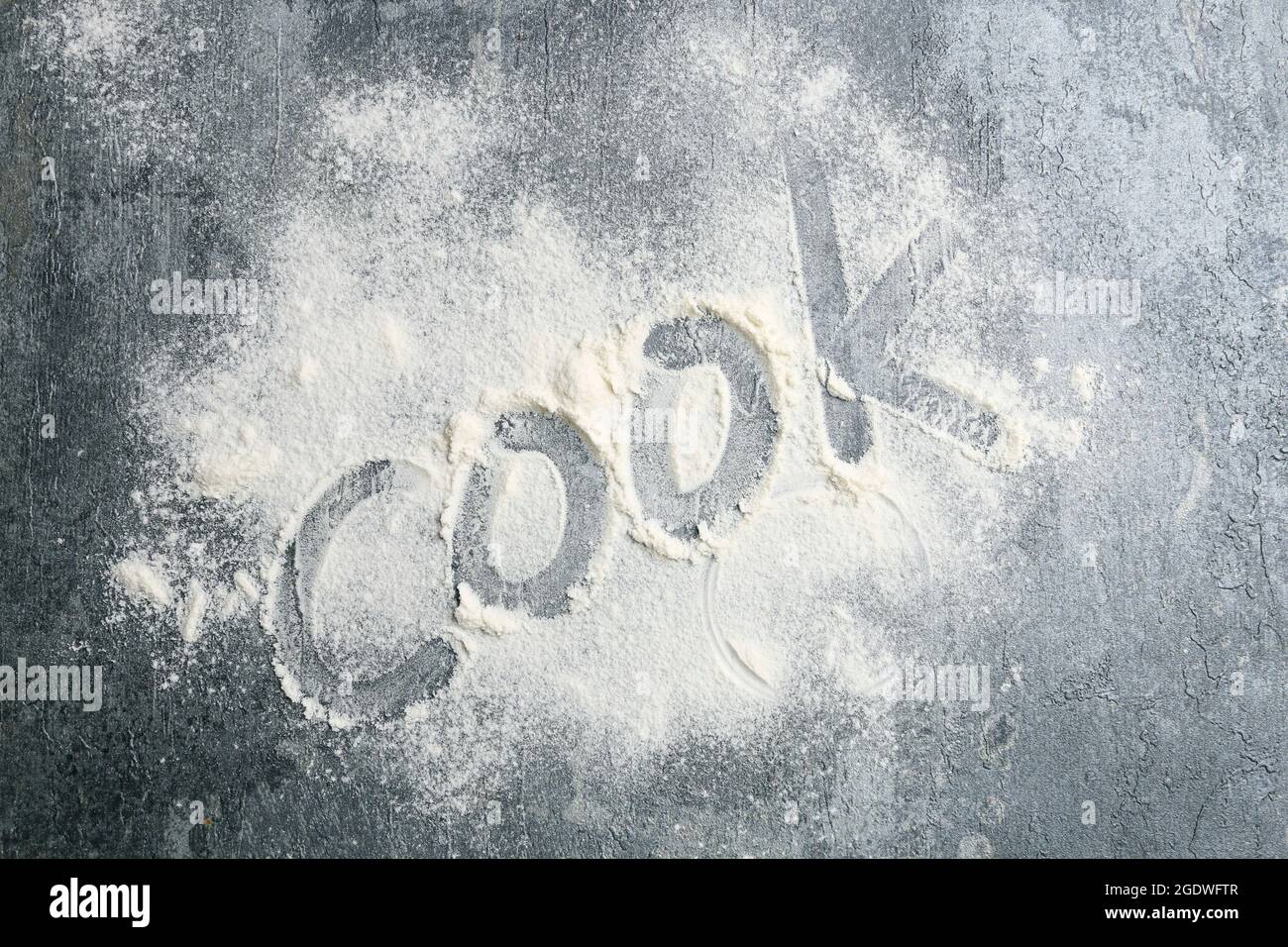 Handwritten word cook on grey stone background. Kitchen ideas Stock ...