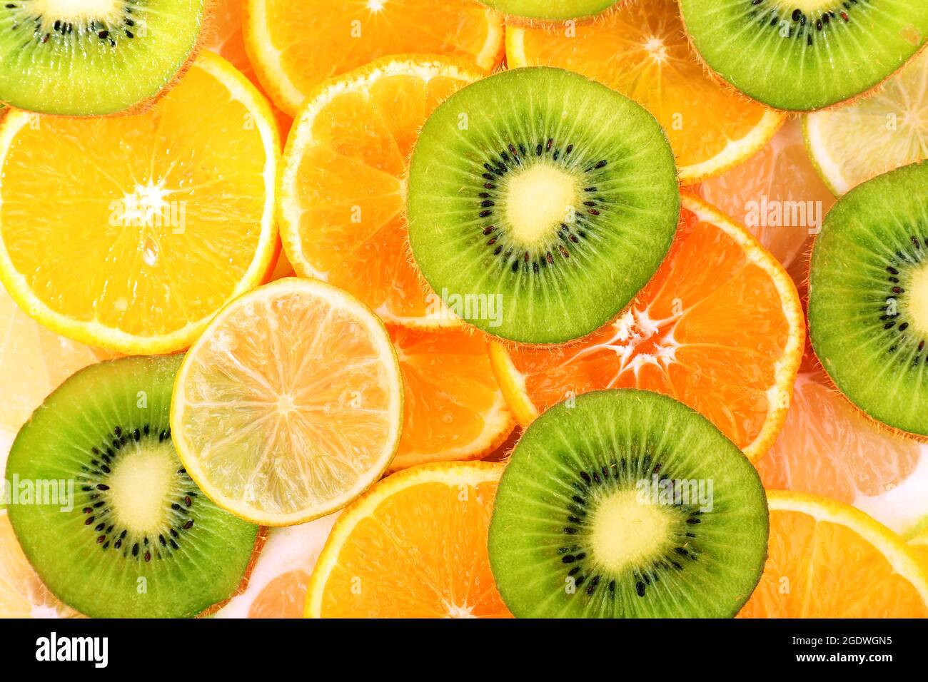 Sliced citrus close-up background Stock Photo - Alamy