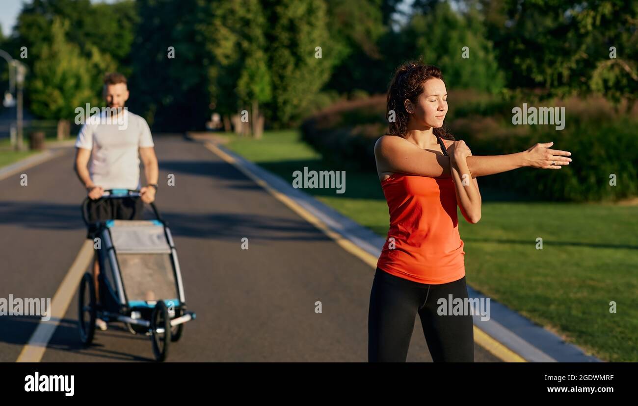Young family with their child doing morning workout. Healthy lifestyle ...