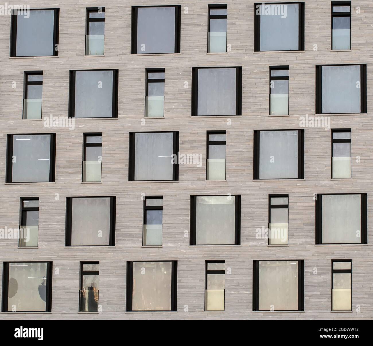 windows in an apartment building as a texture Stock Photo - Alamy