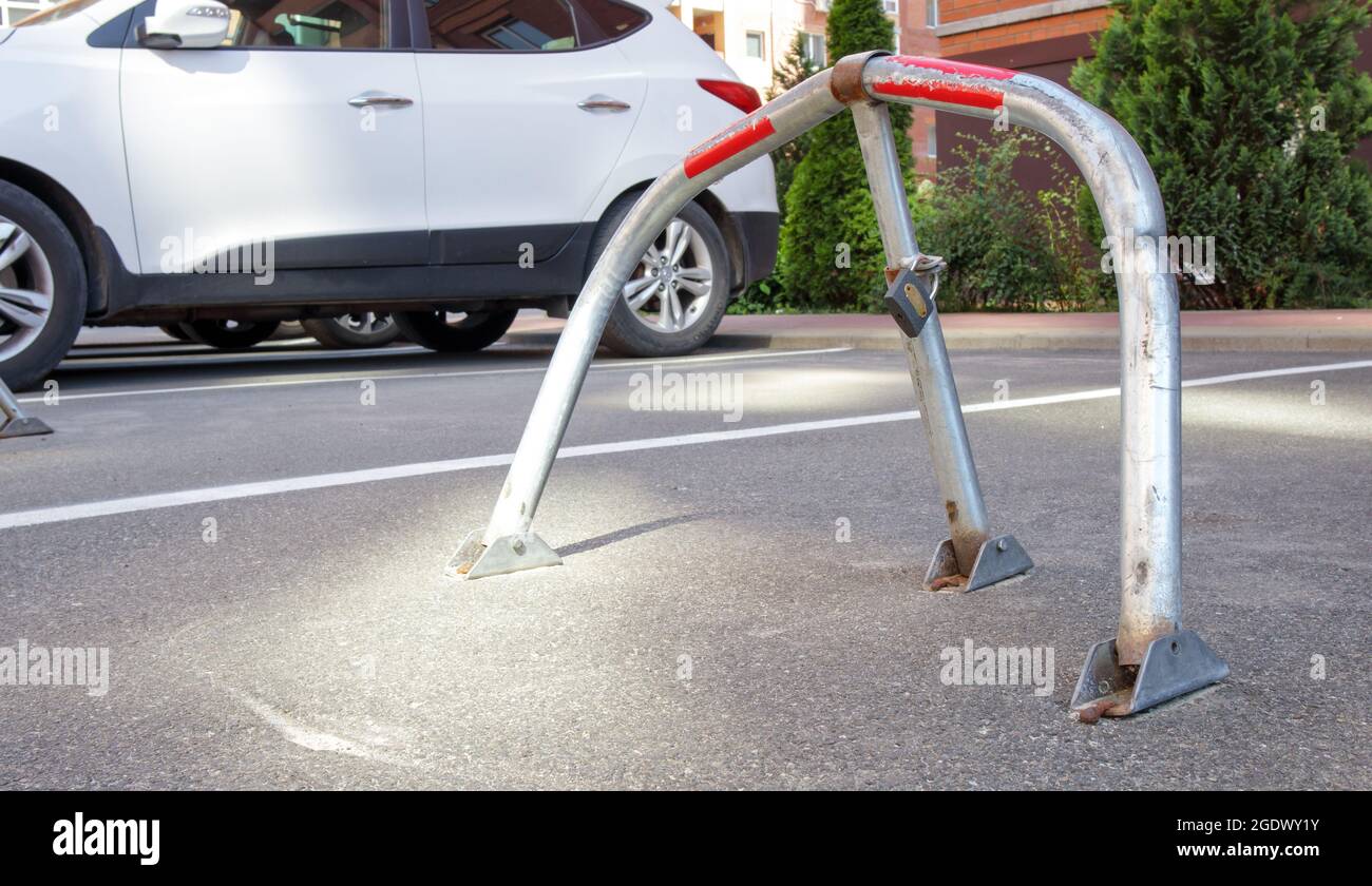 Manual gray galvanized metal parking barrier with lock. Parking lock ...