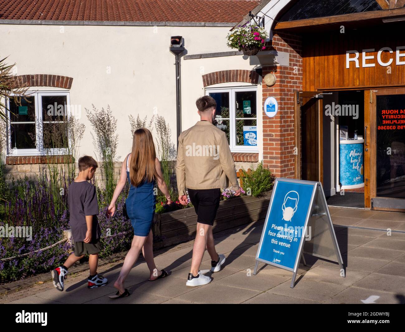 A family arrive at Weymouth Bay Haven Holiday Park reception Stock ...