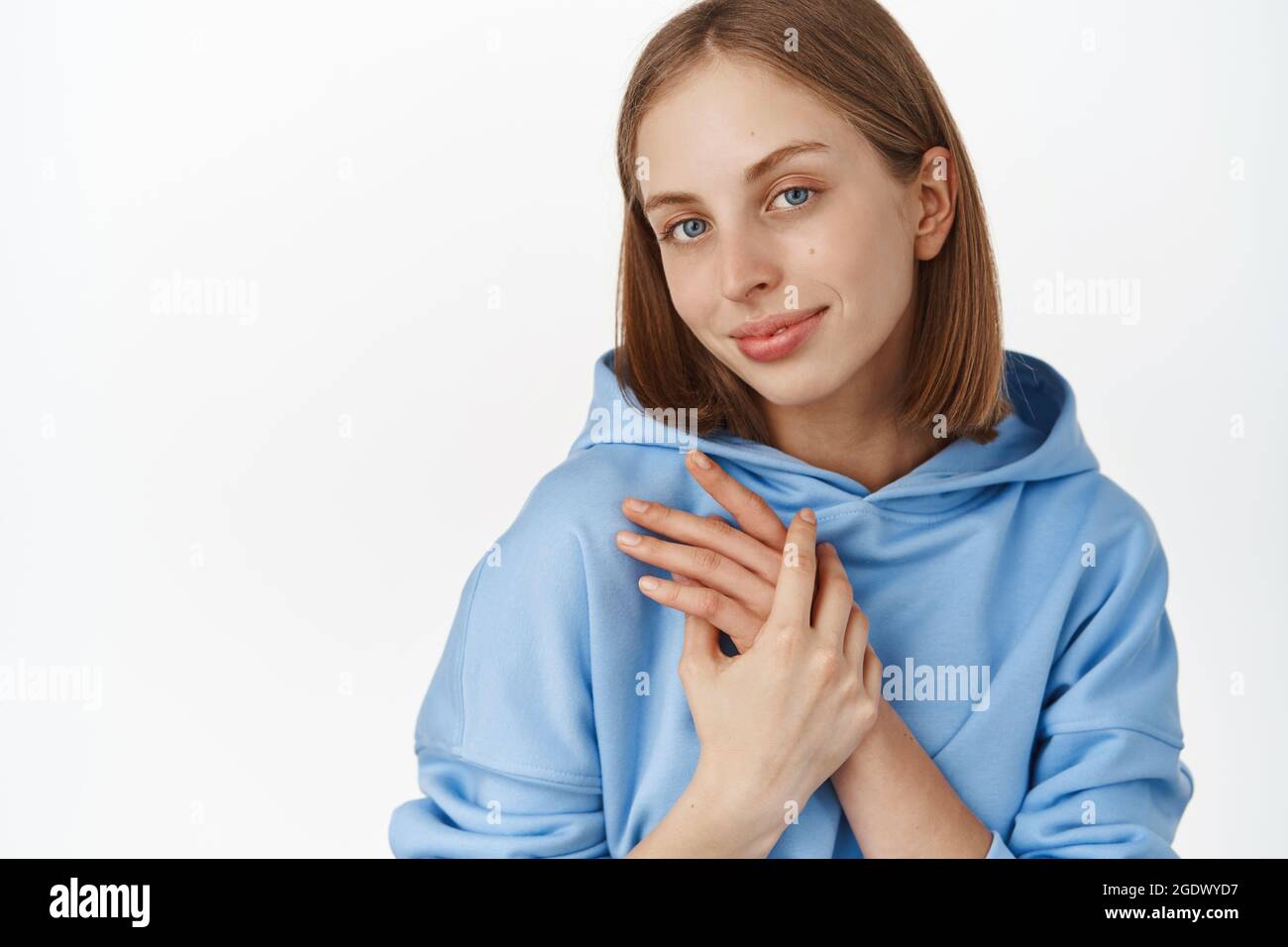 Close up portrait of tender and feminine cute girl, holding hands near ...