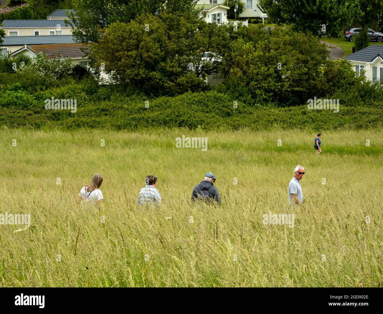 Visitors on the path from Weymouth beach to Seaview Haven holiday park ...