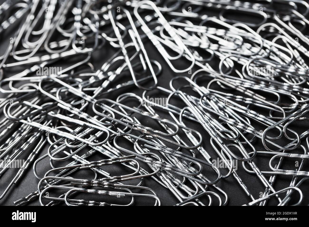 Paper clips scattered as textured background in full screen Stock Photo ...