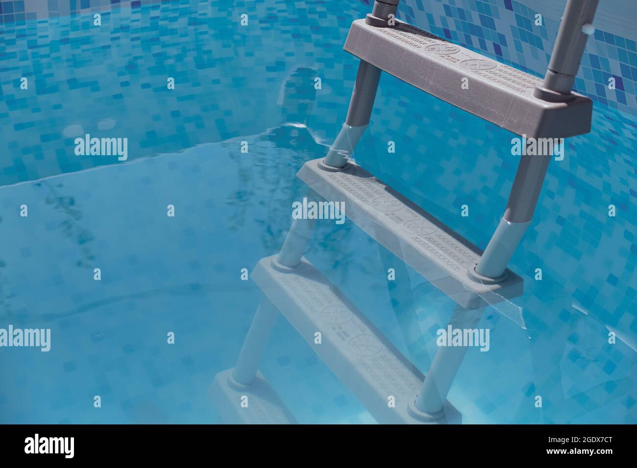 Swimming to the ladder hi-res stock photography and images - Alamy