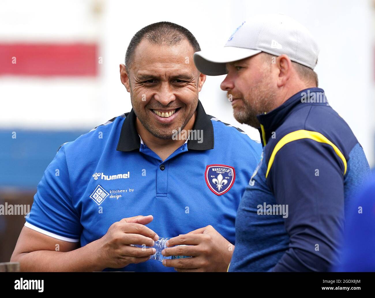 Wakefield Trinity head coach Willie Poching (left) and Warrington ...