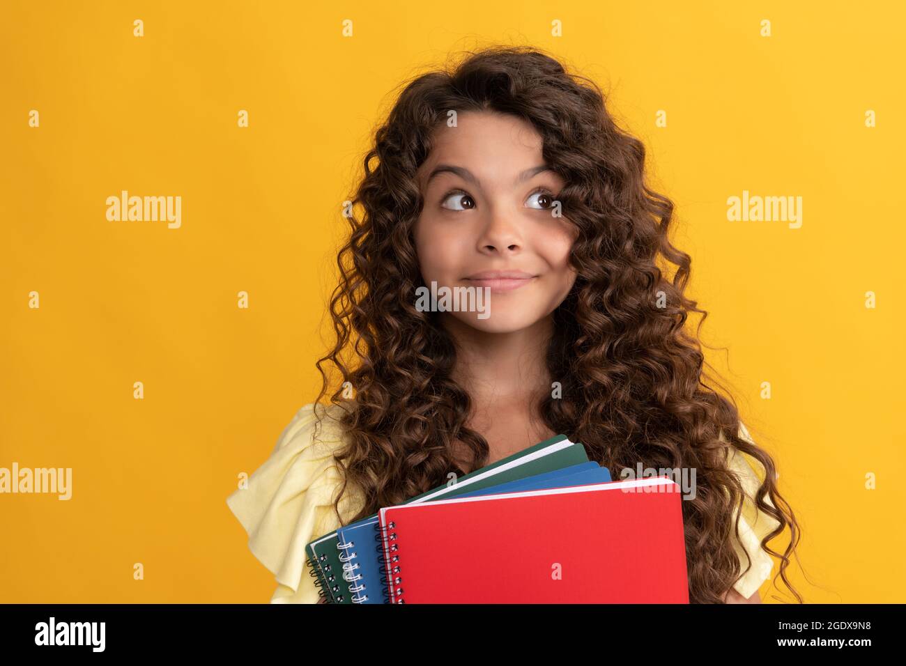 dreamy schoolgirl with copybook. girl with notebook. back to school ...