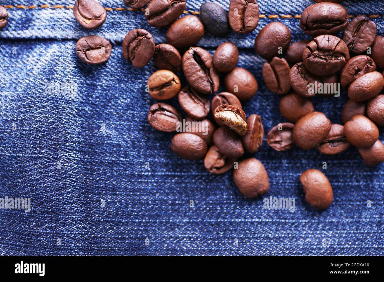 Coffee beans on the jeans background Stock Photo - Alamy